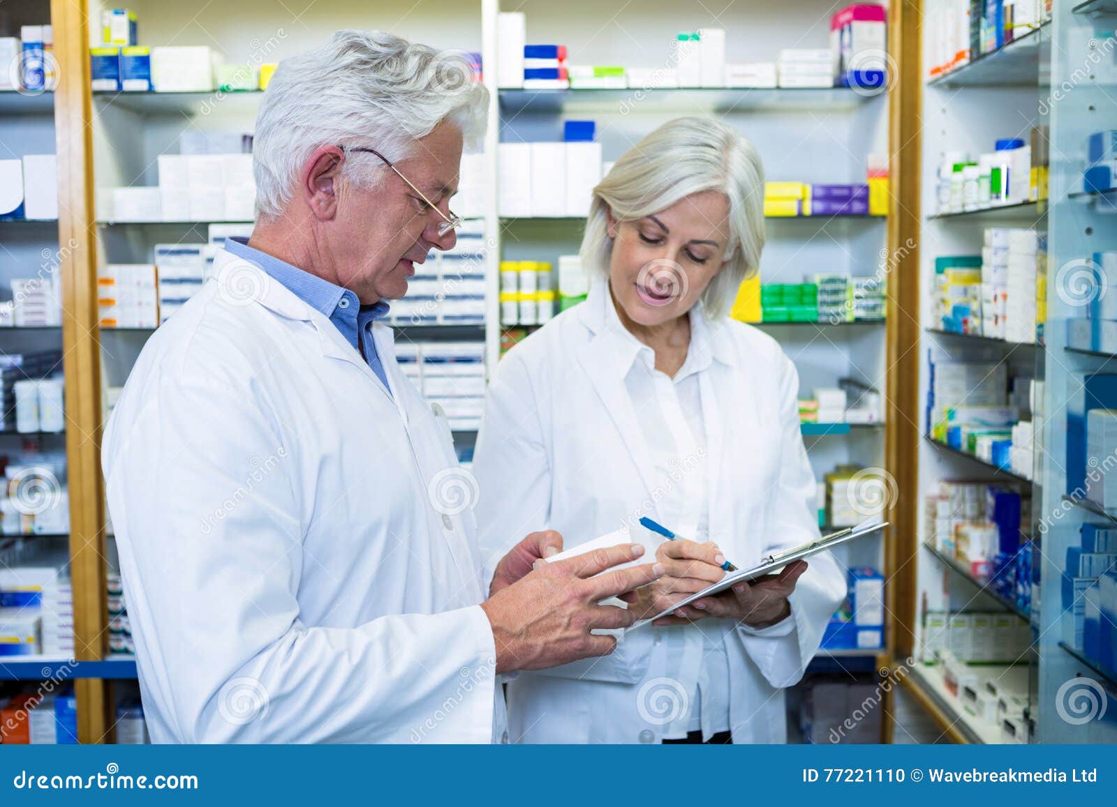 Pharmacists Checking and Writing Prescription for Medicine Stock Photo ...