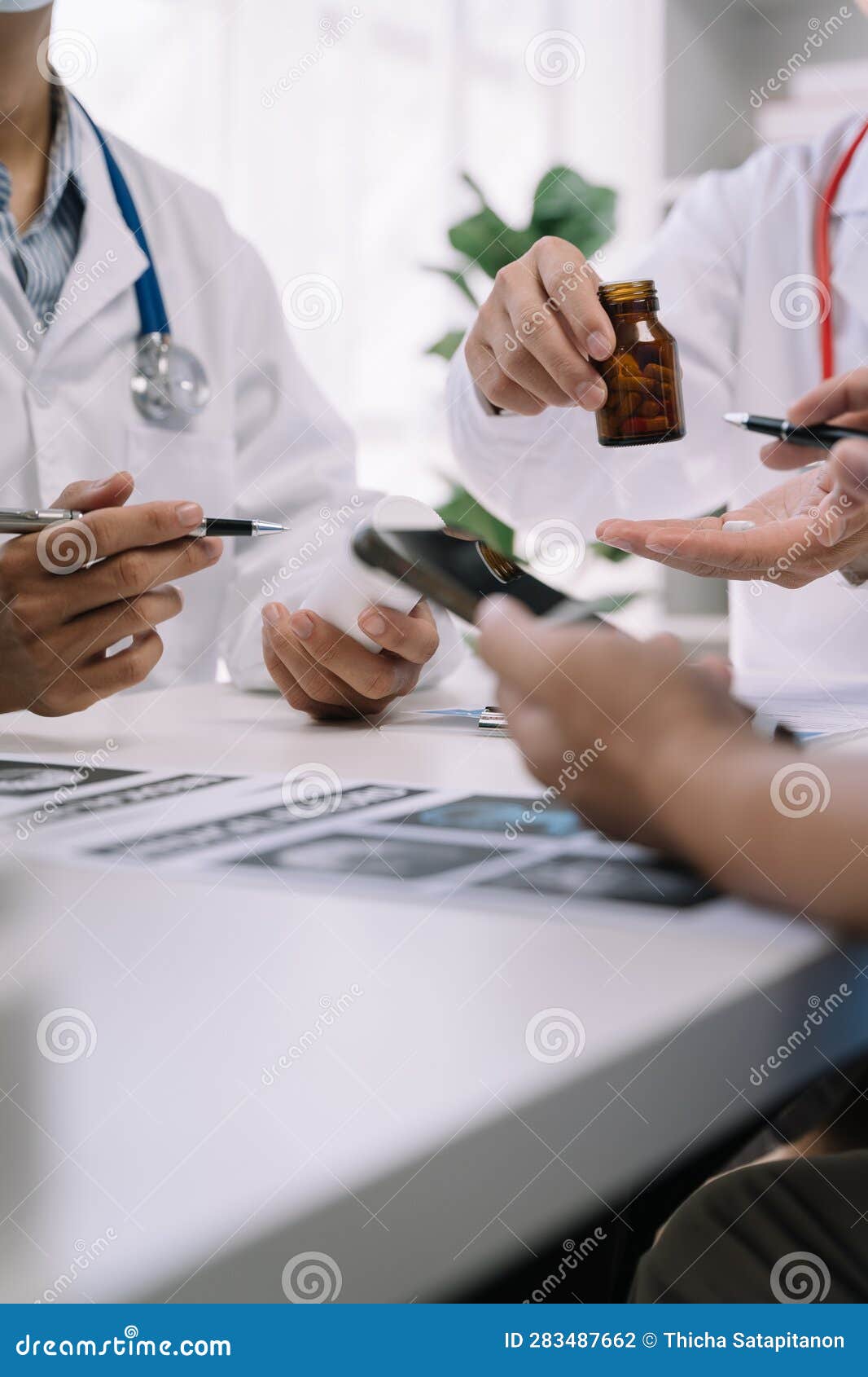Pharmacists or Doctors Study Information about Tablets in the Operating ...