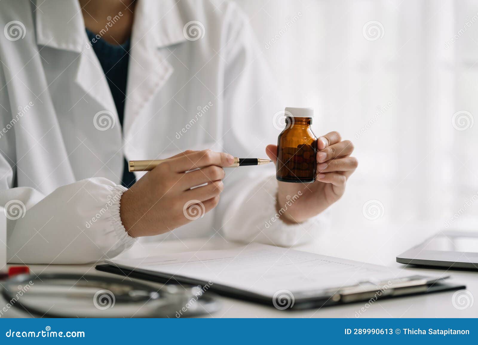 Pharmacists or Doctors Study Information about Tablets in the Room ...