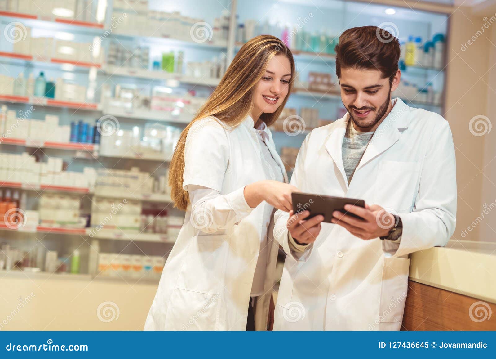 Pharmacists Using Digital Tablet while Checking Medicine Stock Image ...