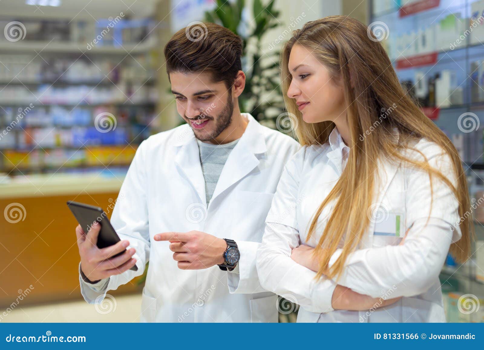 Pharmacists Using Digital Tablet while Checking Medicine Stock Photo ...