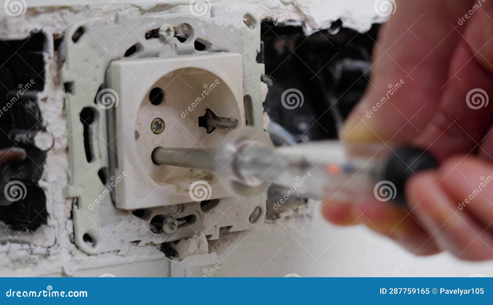 Phase Check of an Old Broken Socket by an Electrician with a ...