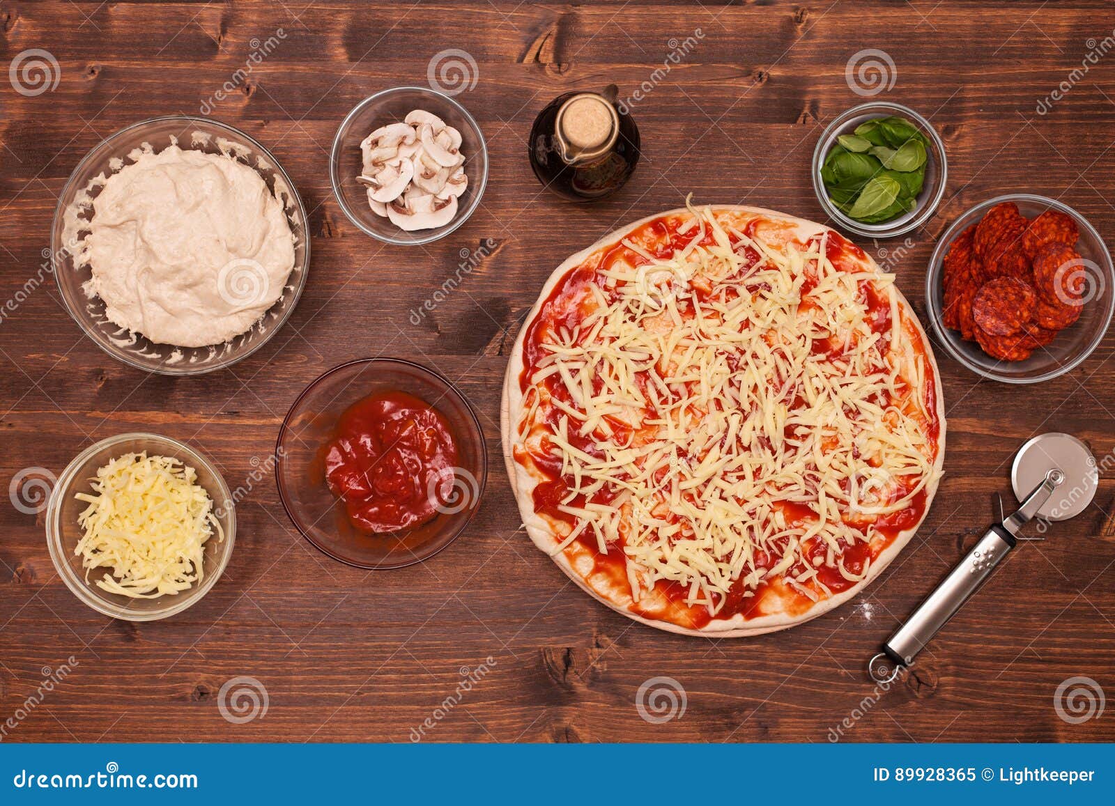 Phases of Making a Pizza - Putting on the Grated Cheese Stock Image ...
