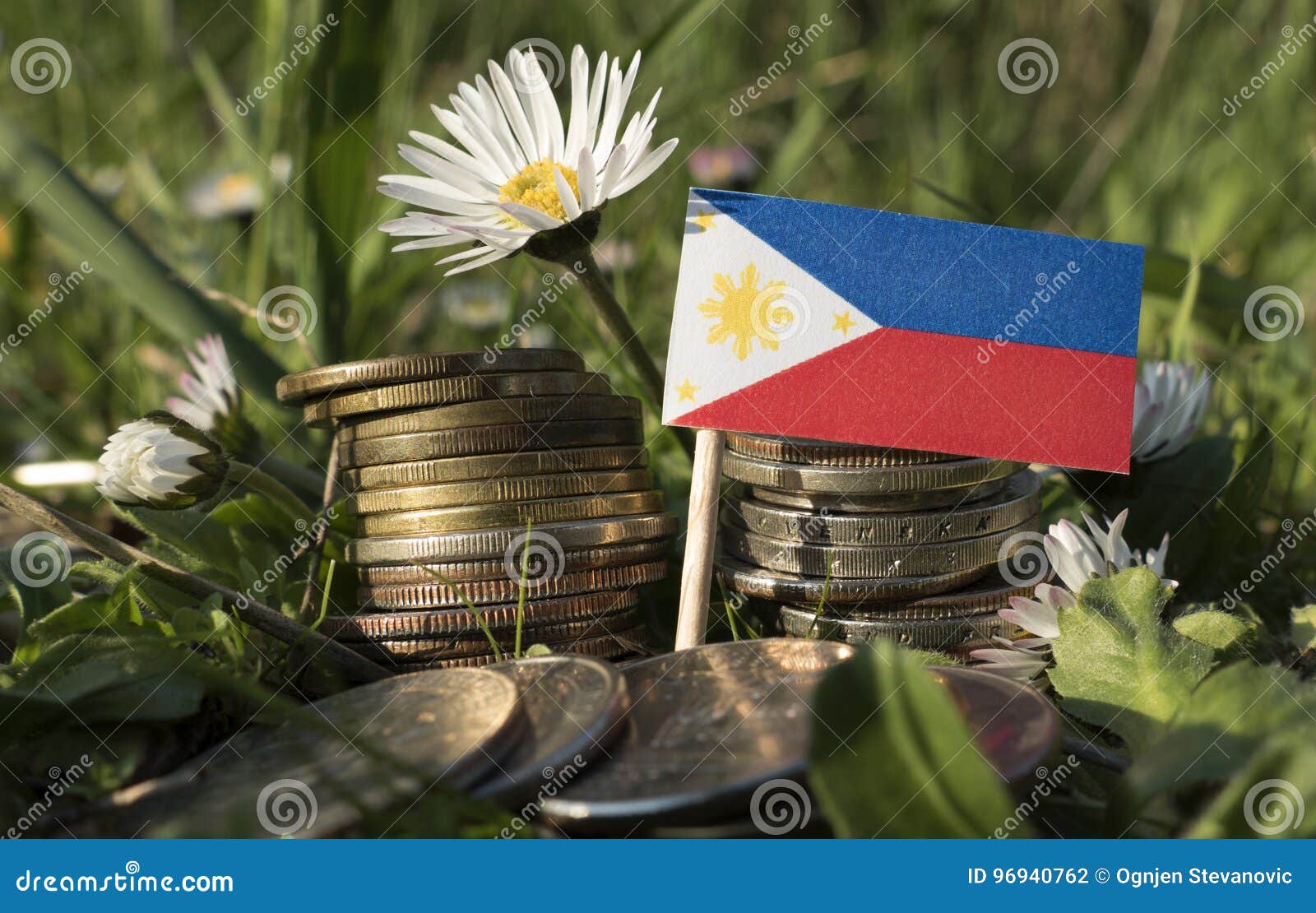 Philippines Flag with Stack of Money Coins with Grass Stock Photo ...