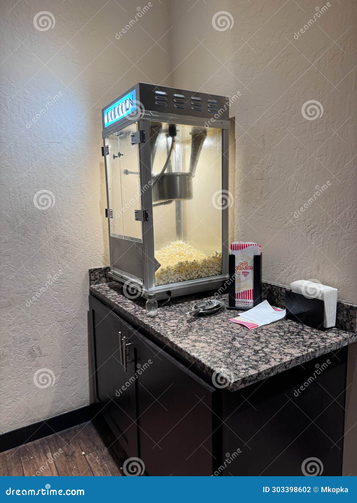 Popcorn Maker Filled with Buttery Popcorn for Self Serve Editorial ...