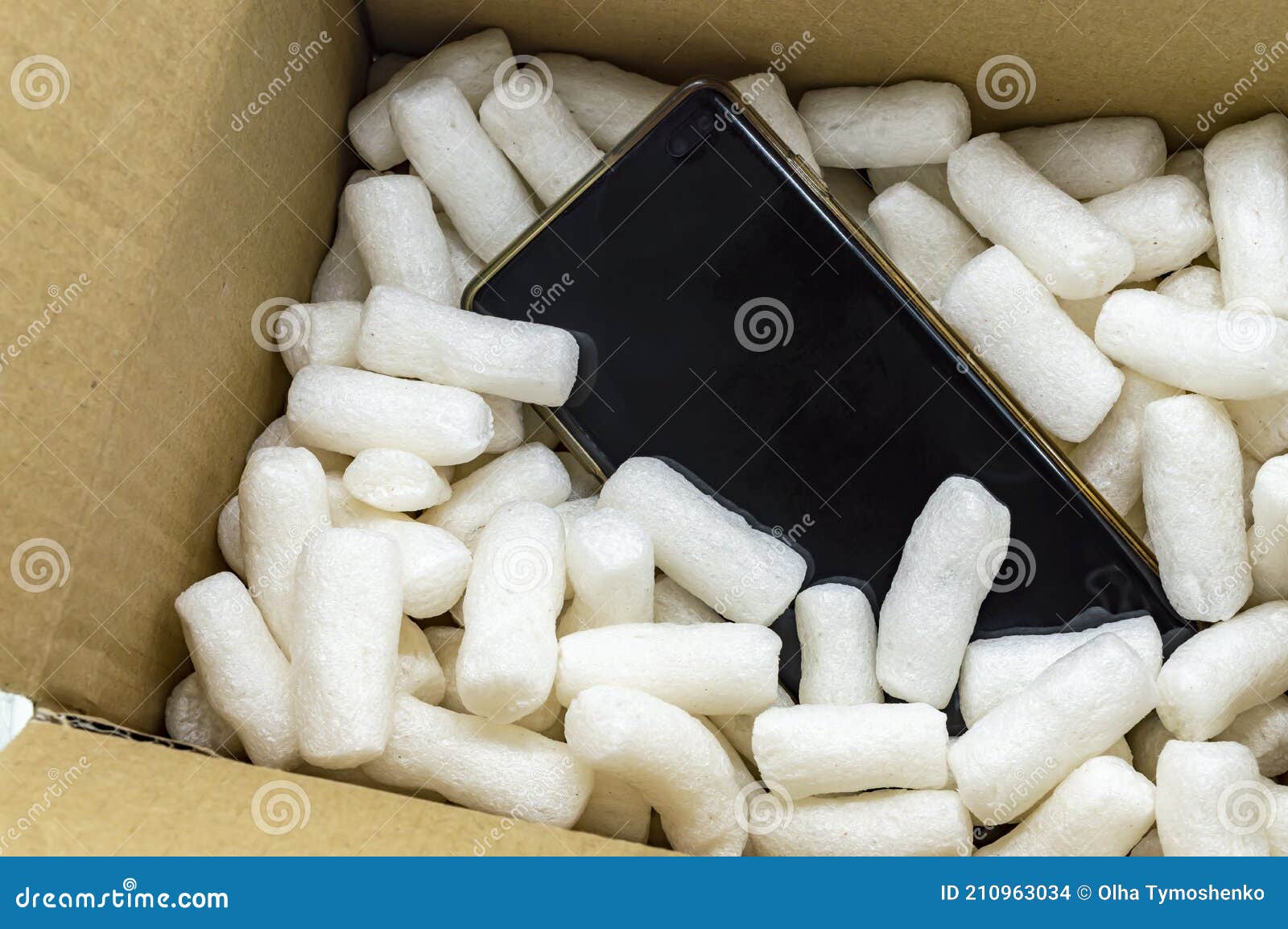 Phone in a Box in Foam Sticks Top View Stock Photo - Image of copyspace ...