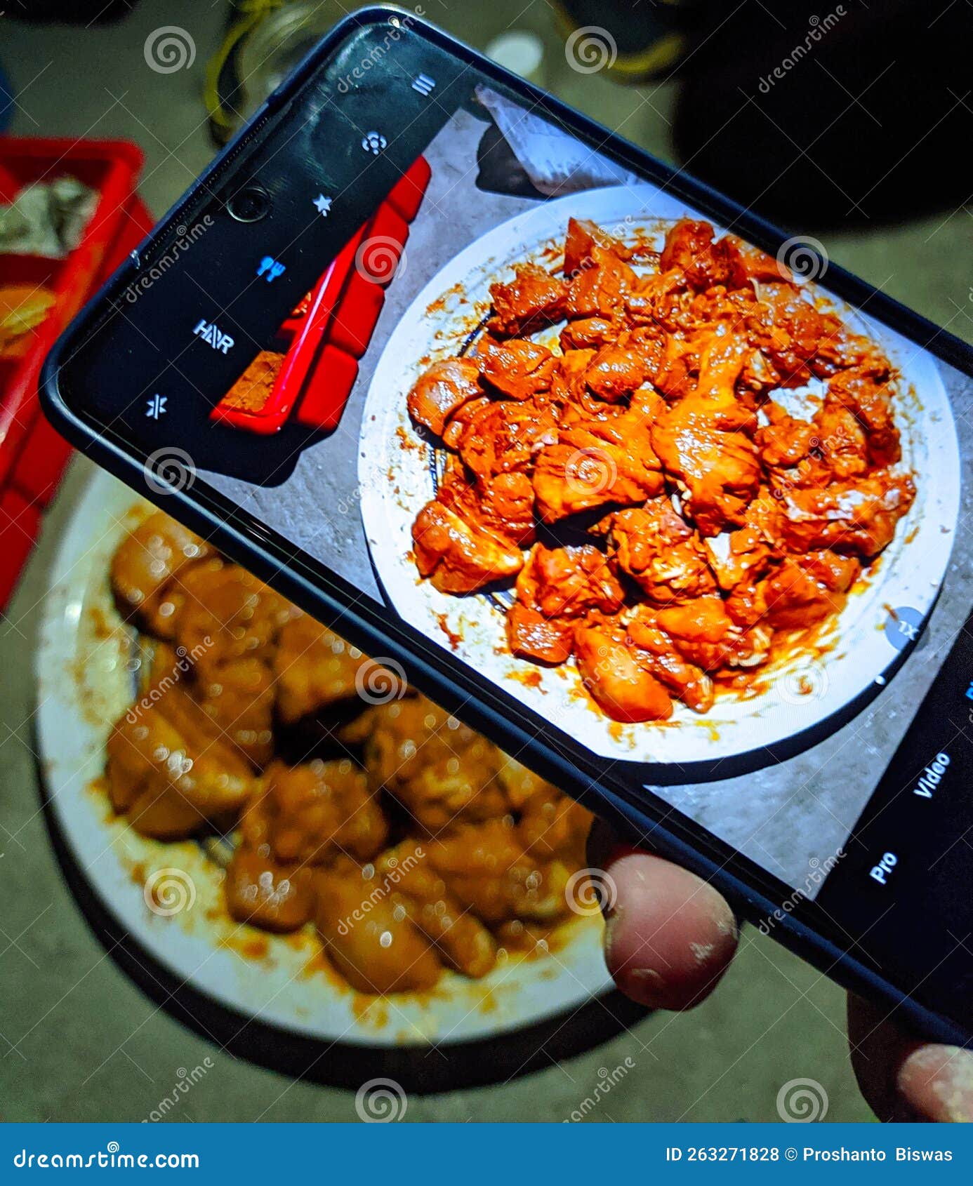 Phone Capturing a Photo of a Plate of Masala Mixes Meat Stock Photo ...