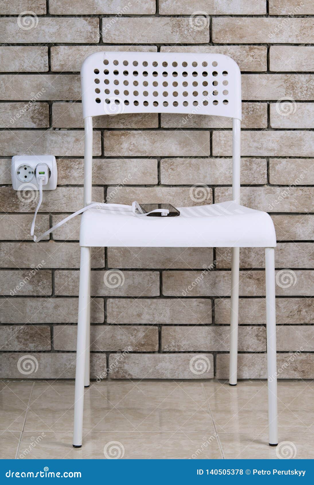 Phone on the chair stock photo. Image of black, electric - 140505378