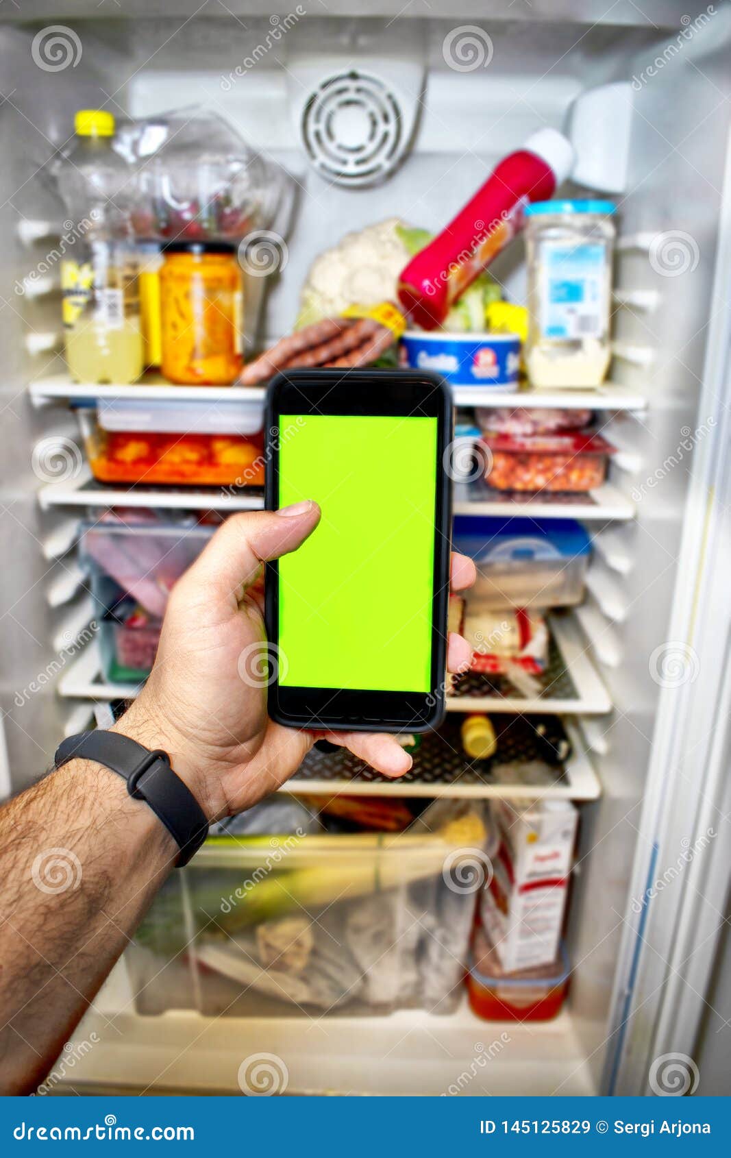 Phone with Green Screen with the Bottom of a Refrigerator Stock Image ...