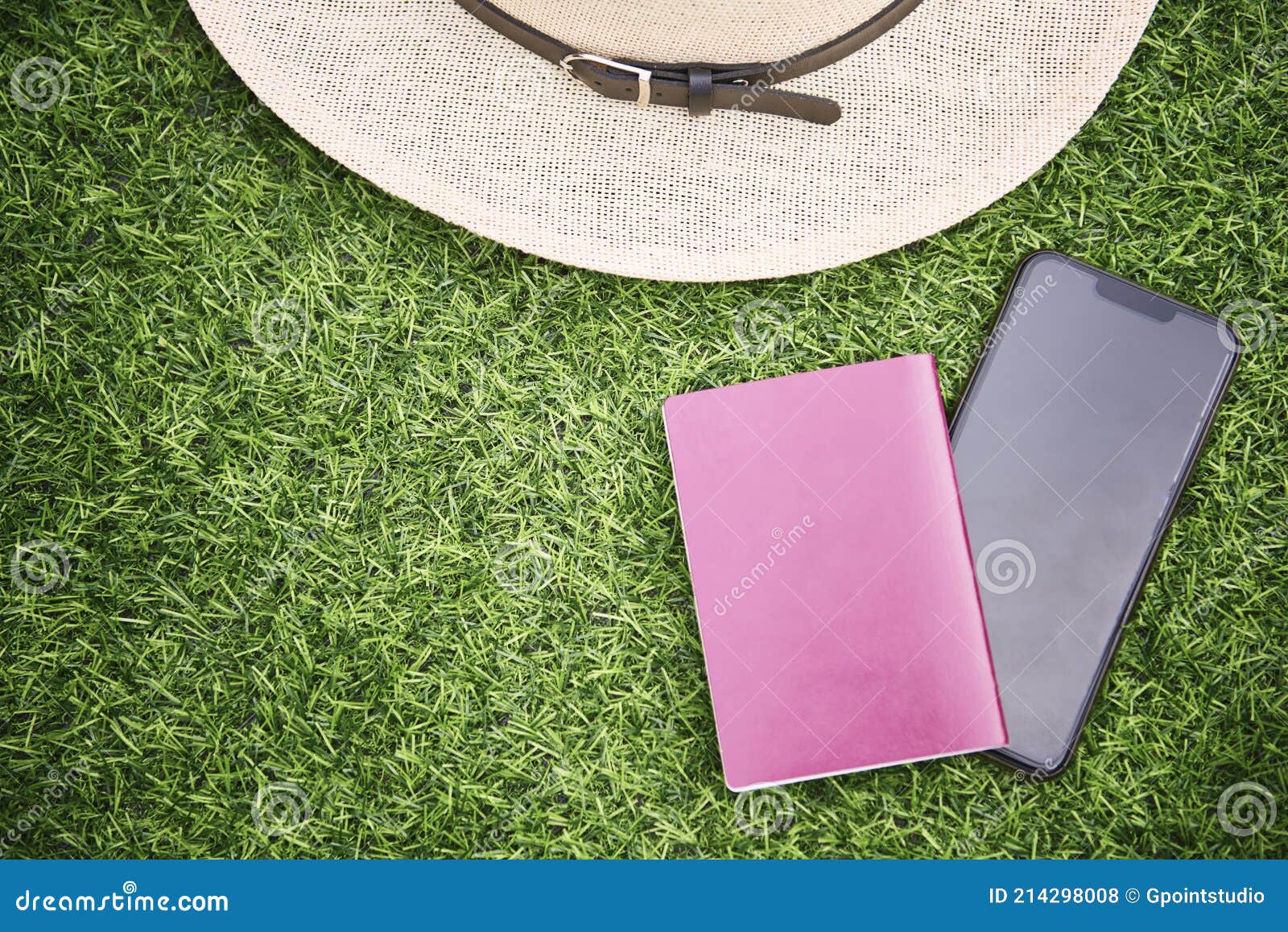 Top View of Phone Hat and Passport on Green Grass Stock Photo - Image ...
