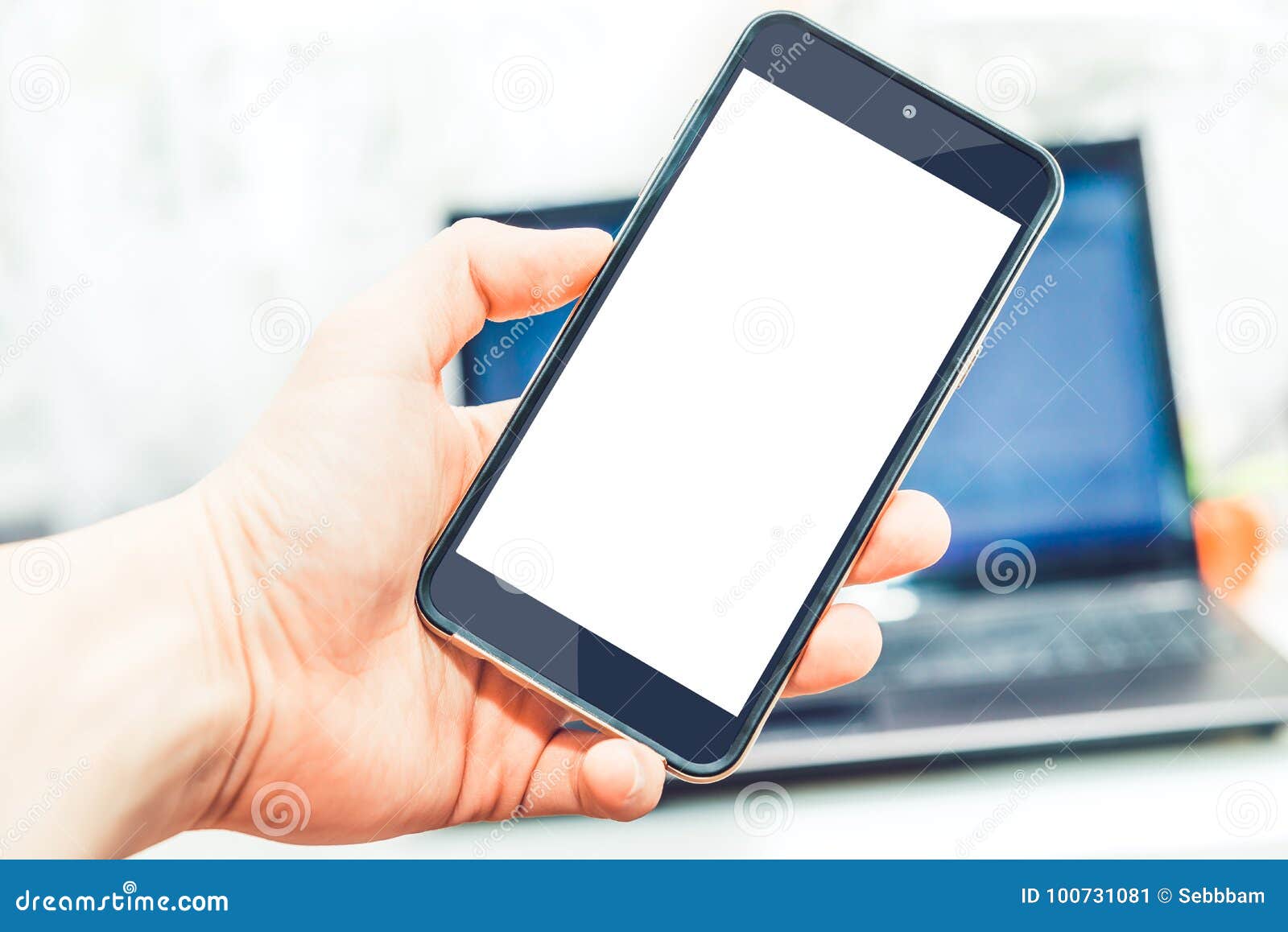Phone Held in Hands in the Background Laptop. Stock Image - Image of ...