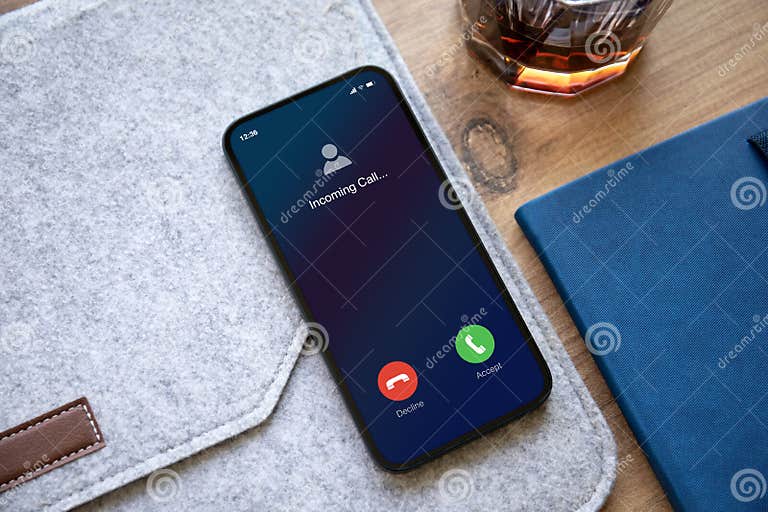 Phone with Incoming Call on Screen Background Table in Office Stock ...