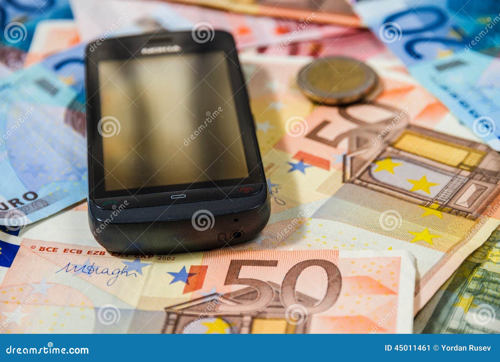 Phone and money stock image. Image of cell, currency - 45011461