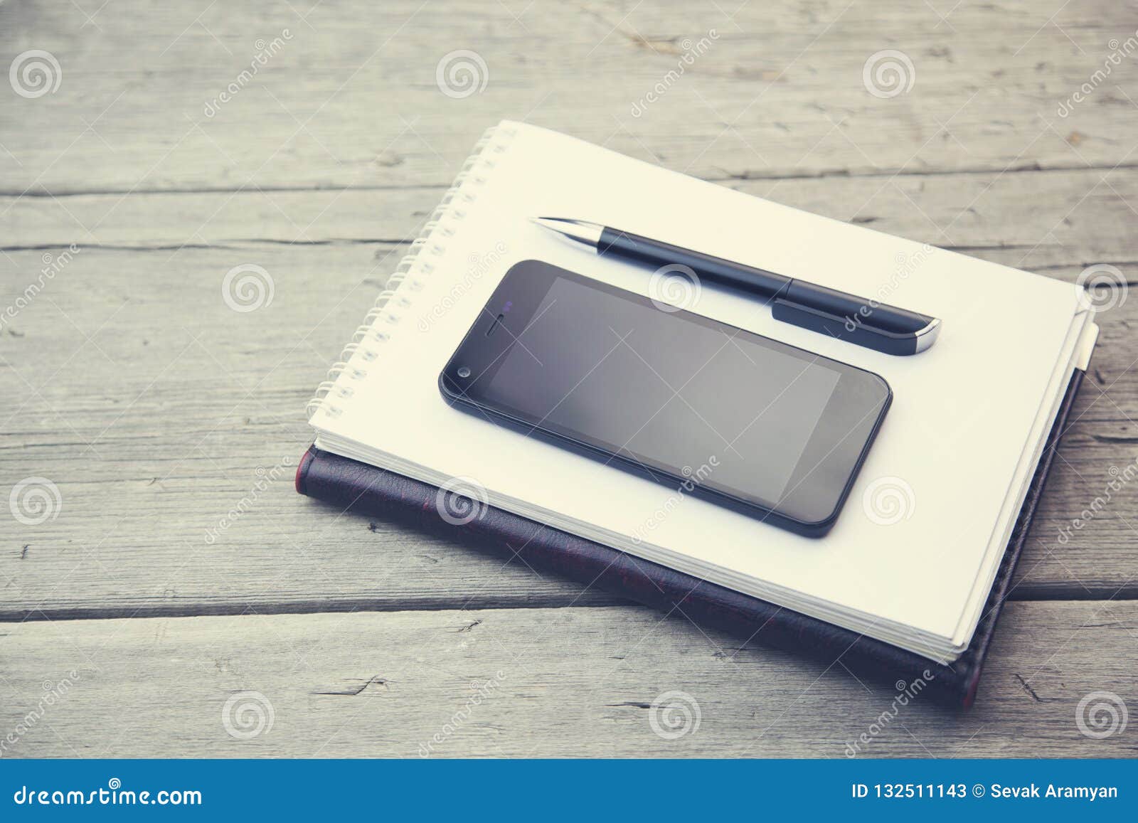 Phone on notebook stock image. Image of smart, diary - 132511143