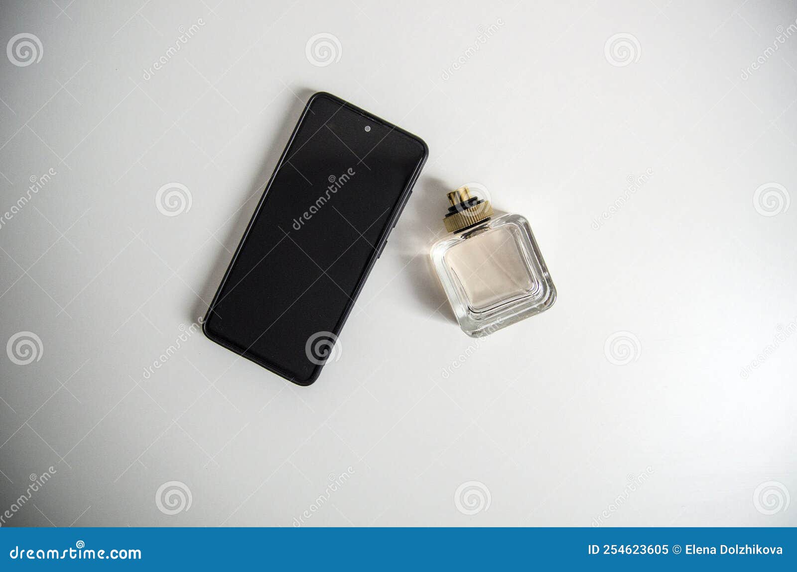 Phone and Perfume on a White Background Stock Image - Image of daylight ...