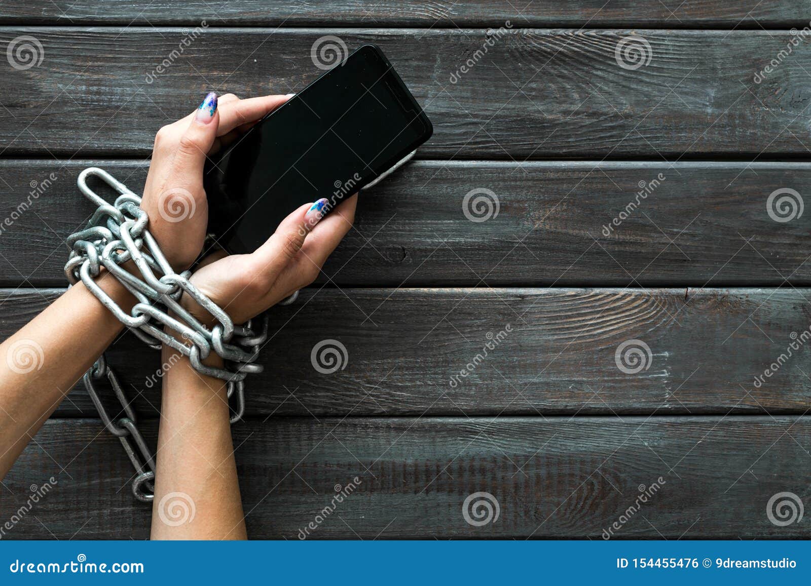 Phone Security System with Mobile in Hands and Chain on Wooden ...