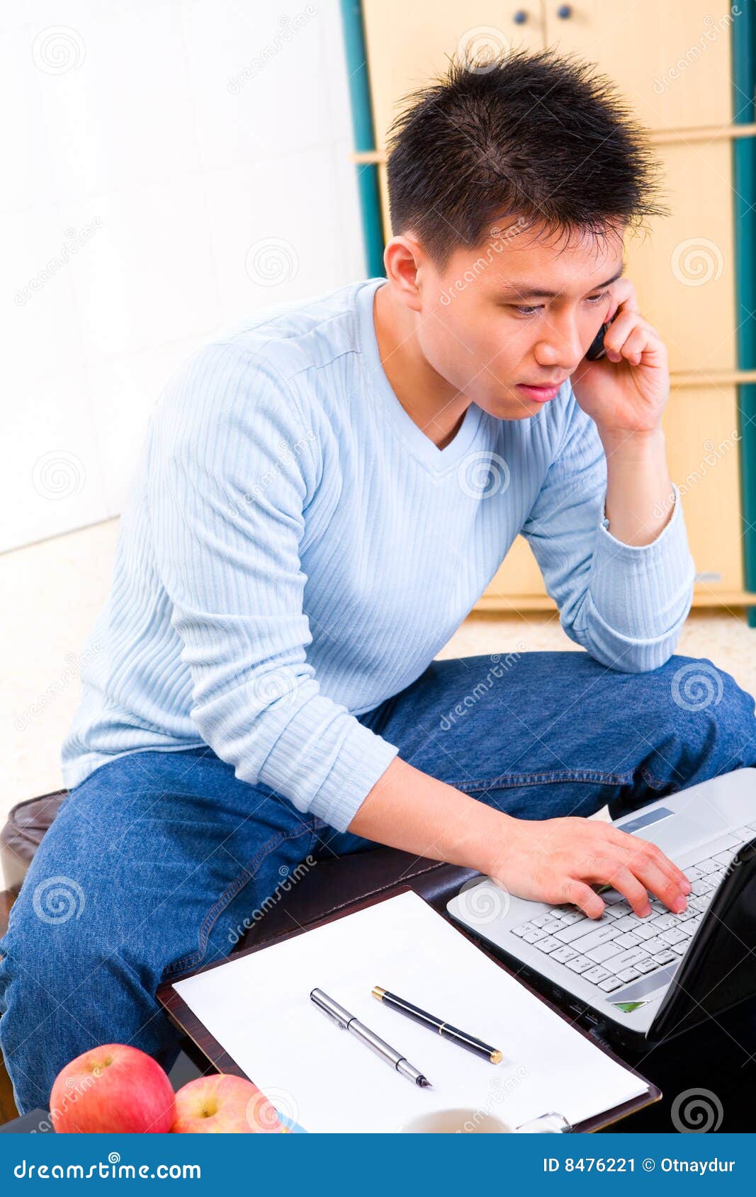 On the phone while working stock image. Image of handsome - 8476221