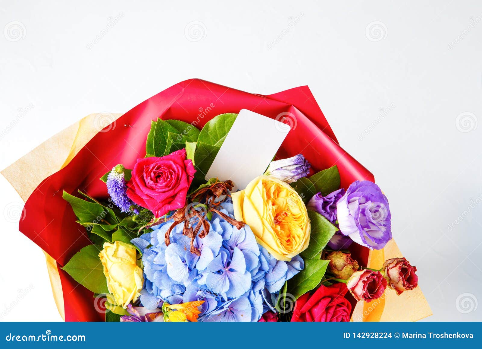 Photo from Above Bouquet of Multi-colored Roses with Card on Empty ...
