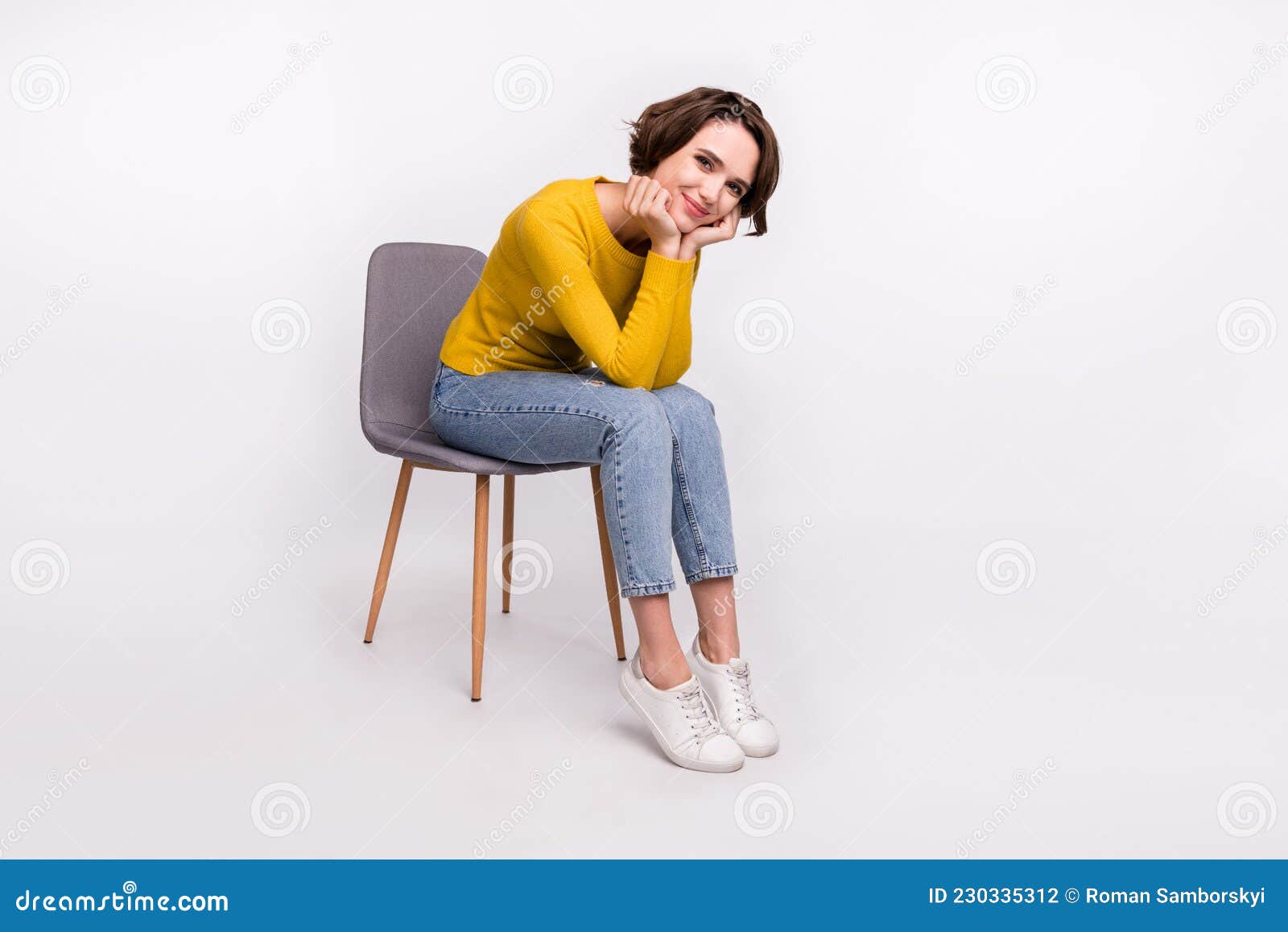 Photo Of Adorable Positive Cheerful Nice Girl Hands Cheeks Sit Chair