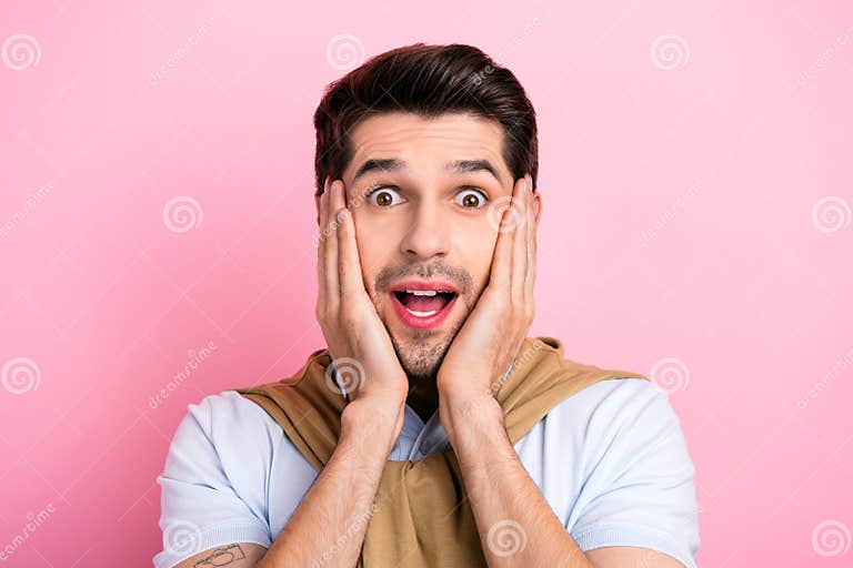 Photo Of Amazed Funny Crazy Guy Brunet Hair Hands Cheeks Open Mouth
