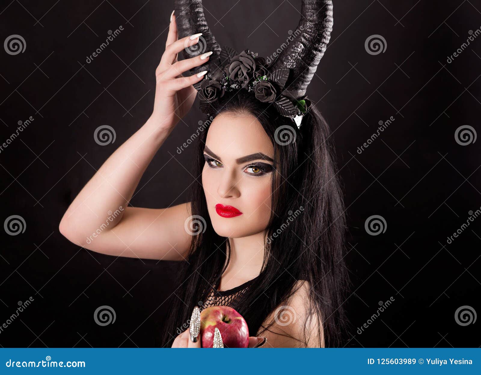 An Apple in the Hands of a Horned Witch Stock Image - Image of face ...