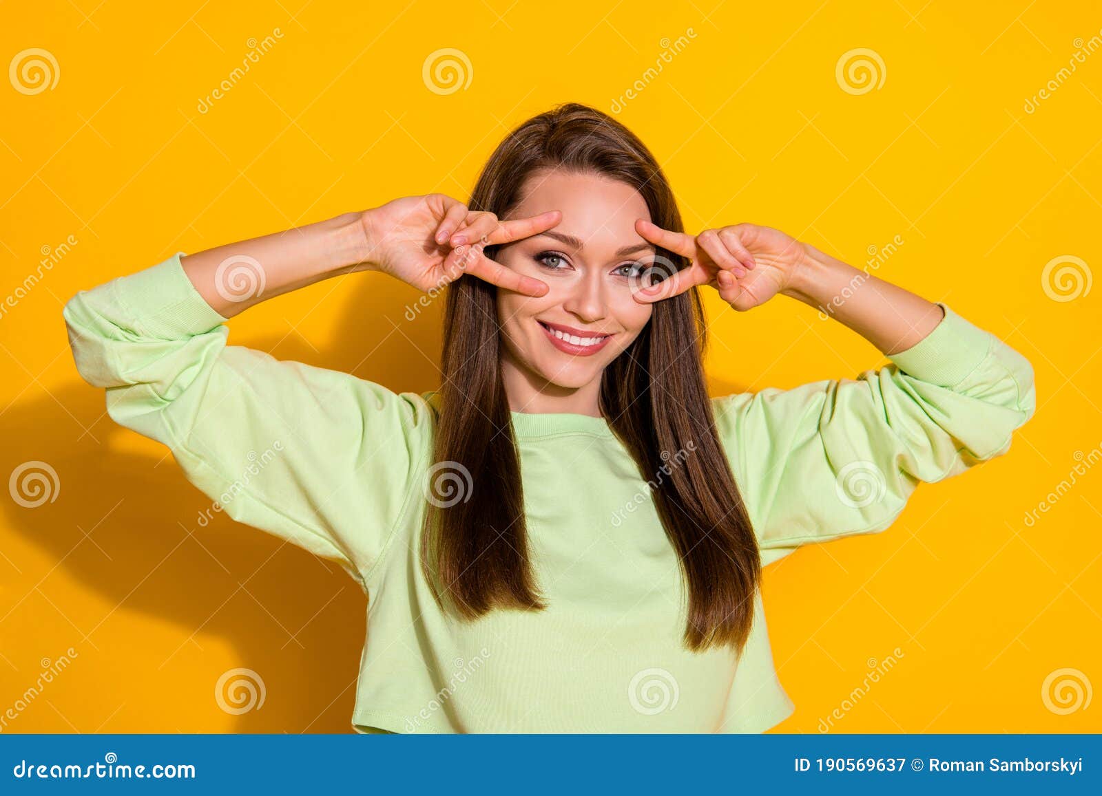 Photo Of Attractive Pretty Funny Lady Good Mood Arms Showing V Sign