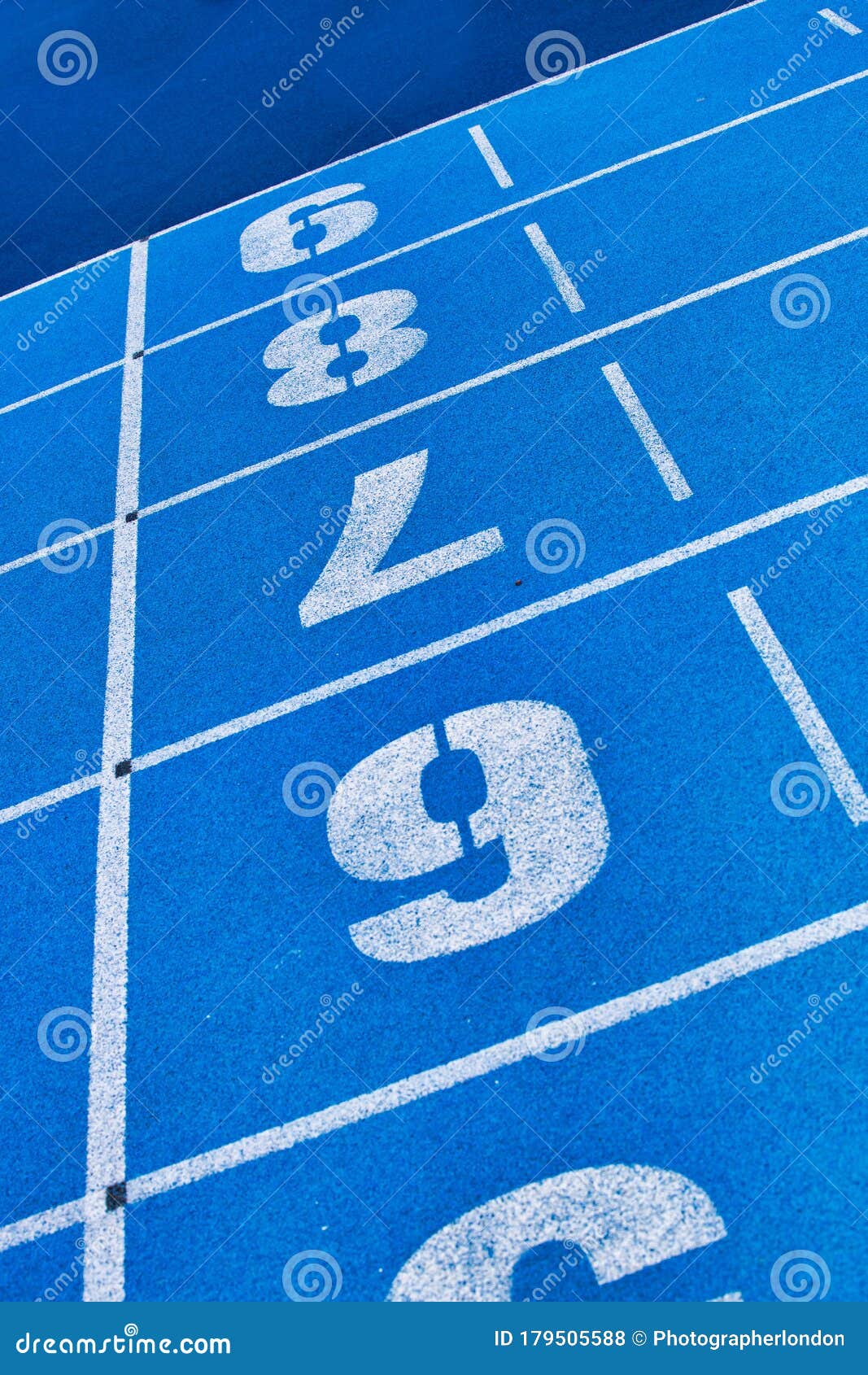 Photo of Blue Stadium Tracks Stock Photo - Image of field, blue: 179505588