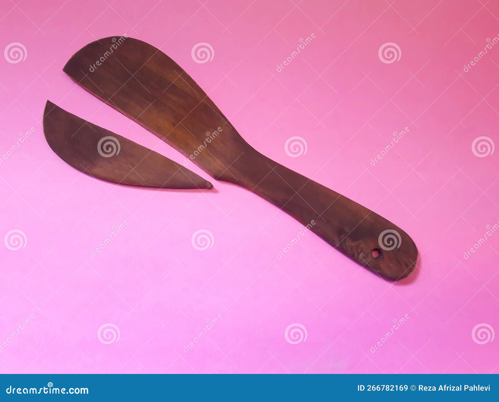 Photo of a Broken Wooden Spoon with a Pink Background Stock Image ...