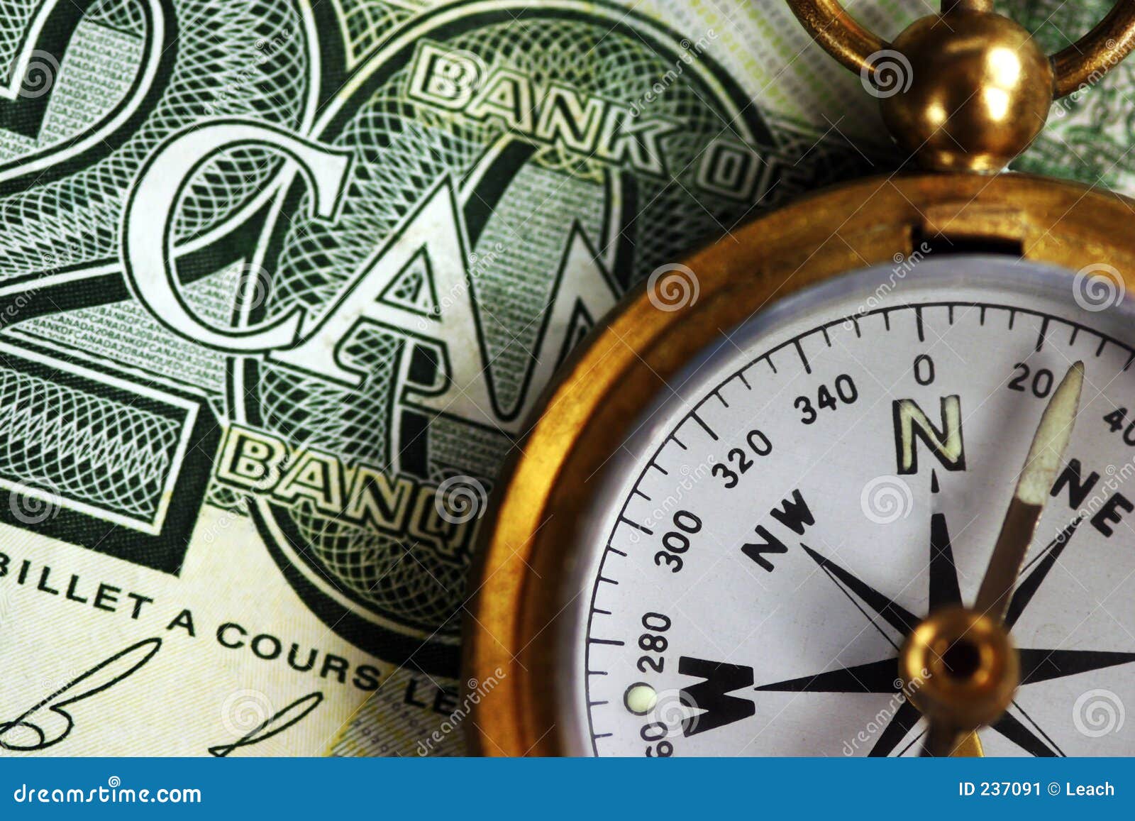 Photo of Canadian Money and Brass Compass Stock Image - Image of south ...