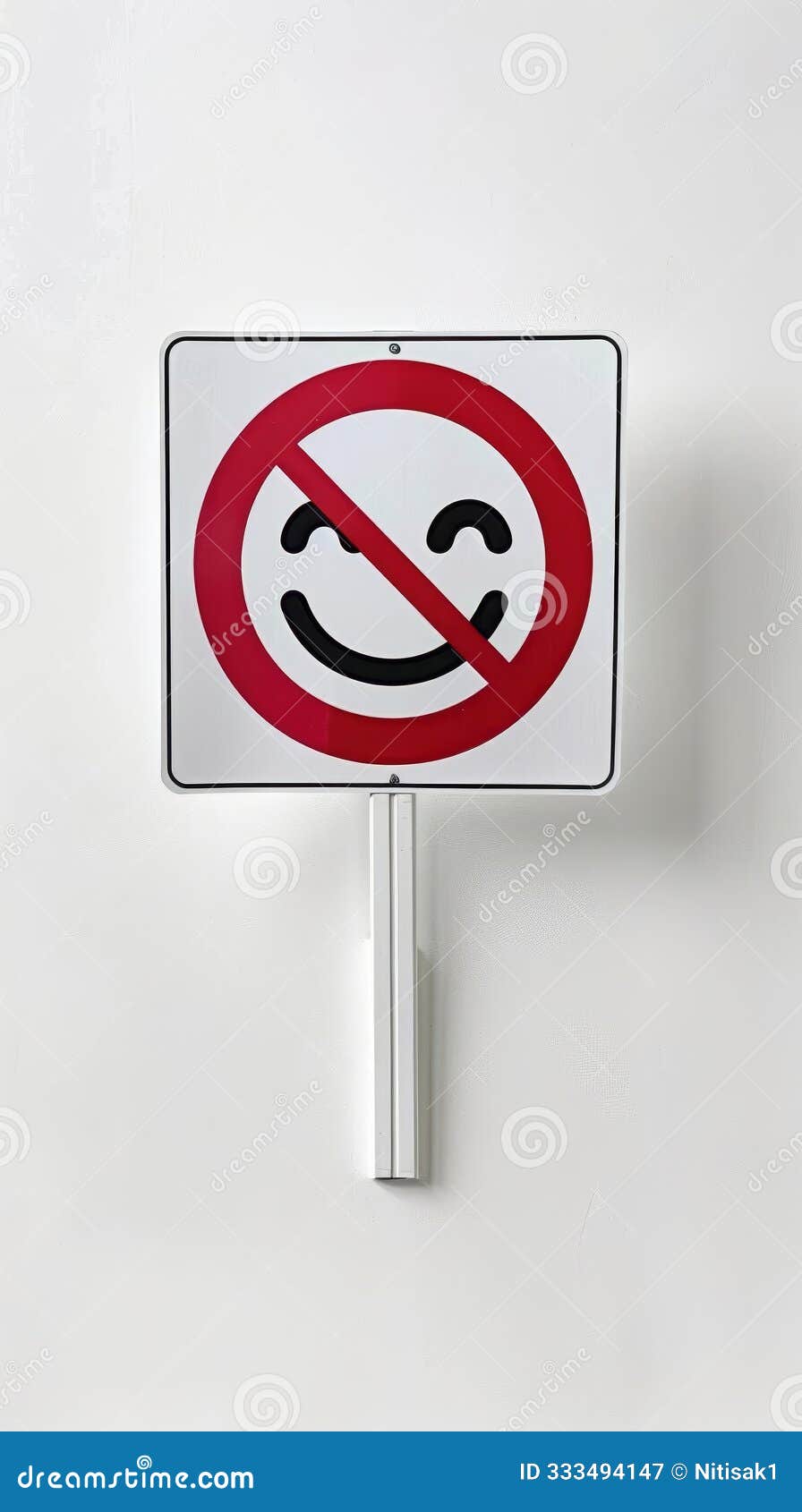 Photo of a Cautionary Sign Indicating No Smiling Allowed Against a ...