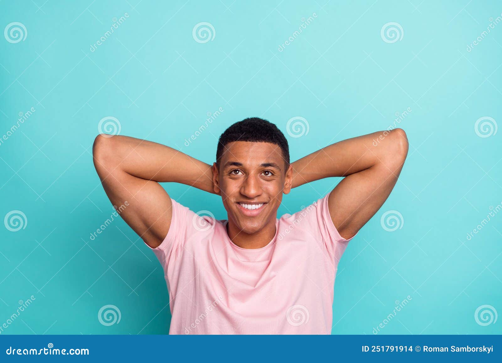 Photo Of Cheerful Funny Young Man Dressed Pink T Shirt Arms Behind Head