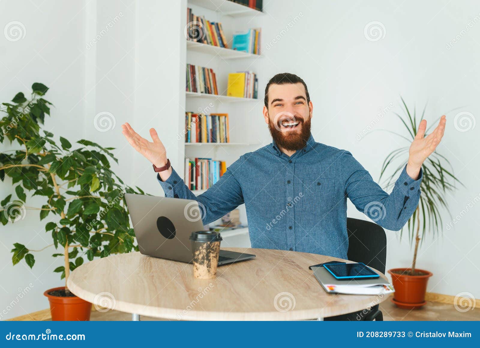 Photo of Cheerful Office Worker Making Welcome Gesture and Smiling ...