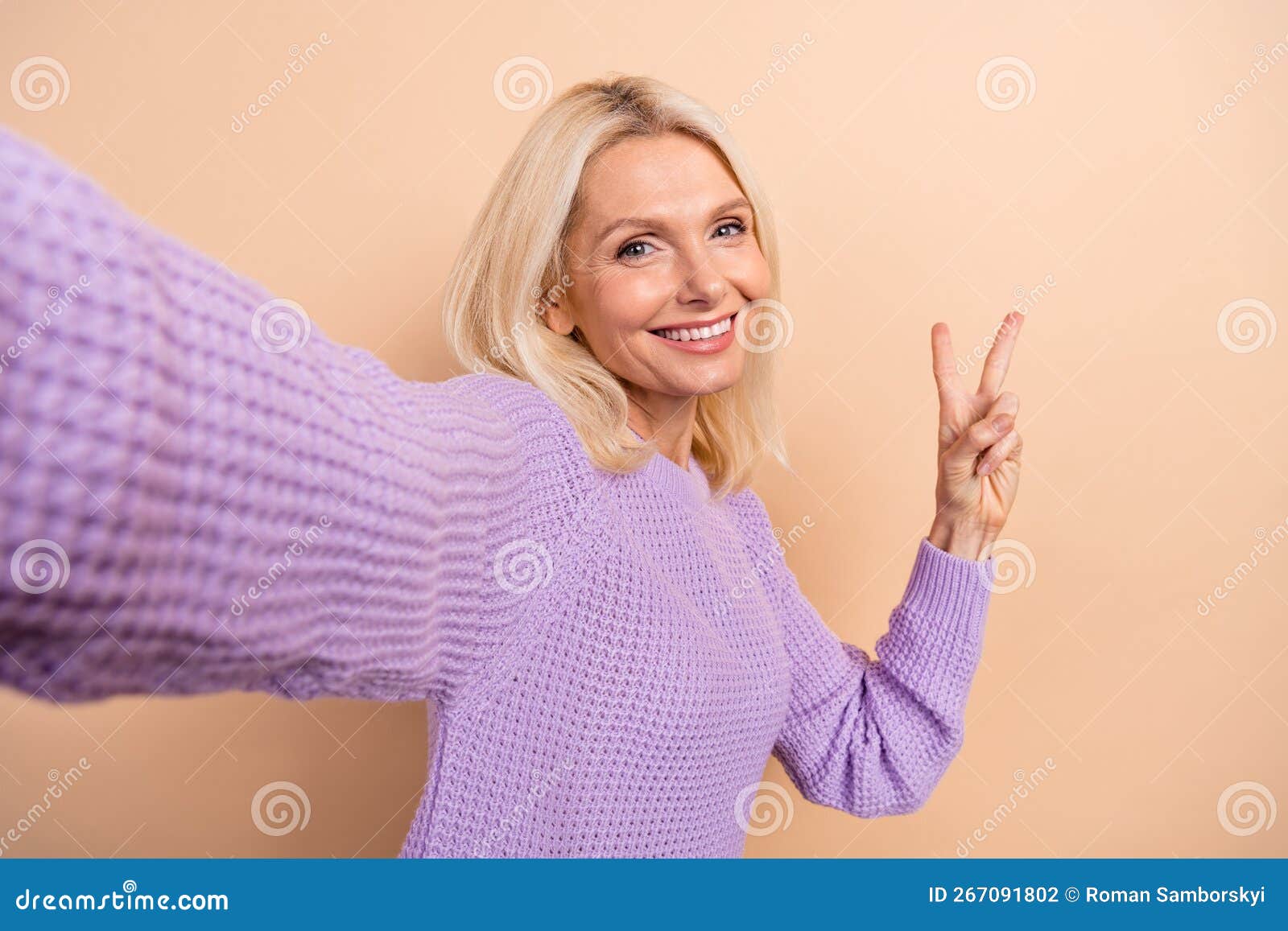 Photo Of Cheerful Optimistic Mature Lady With Blond Hairdo Wear Knit