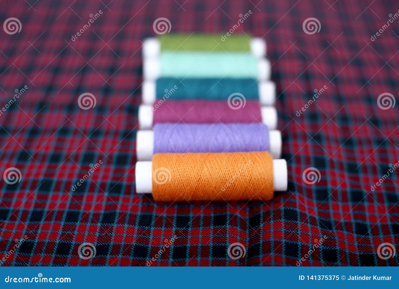 Photo of Colored Sewing Thread on the Cloth Stock Image - Image of ...