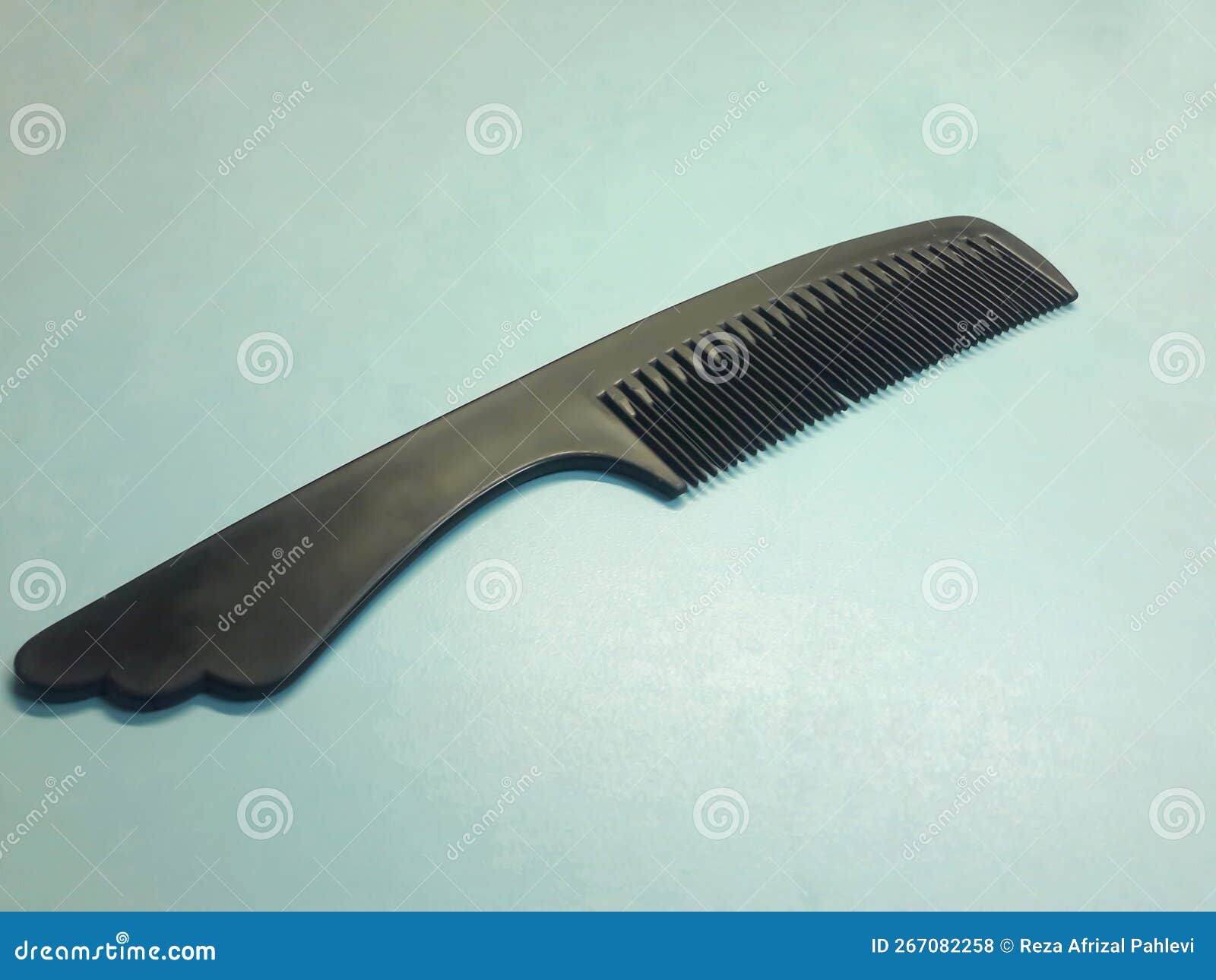 Photo of a Comb on a Table with a Blue Background Stock Photo - Image ...