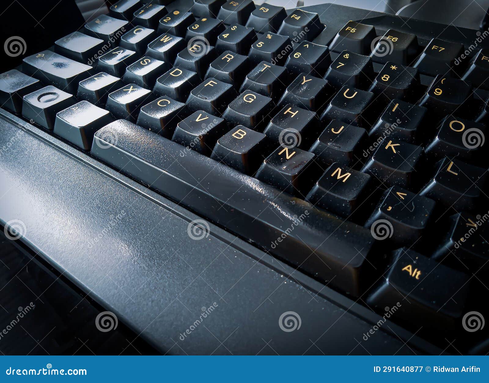 Photo of a Computer Keyboard from an Angled Position Against a Dark ...