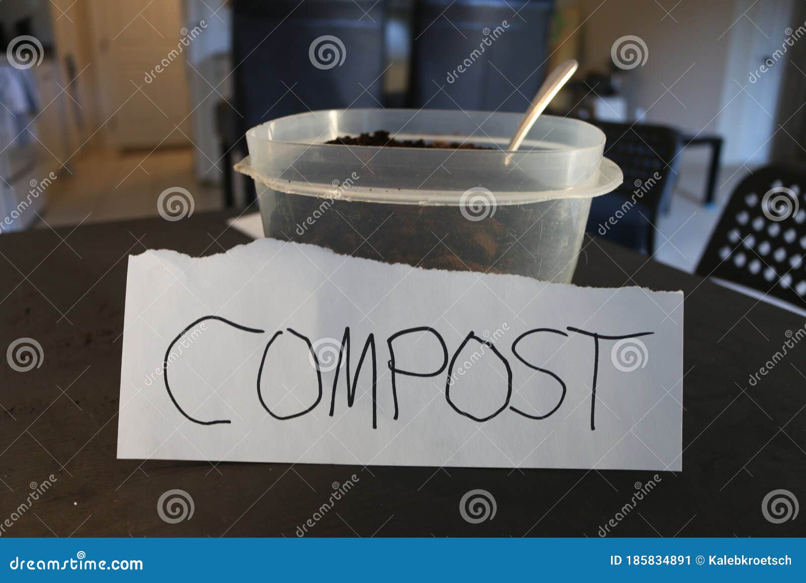 Photo of a Container of Used Coffee Grounds with a Sign that Says ...