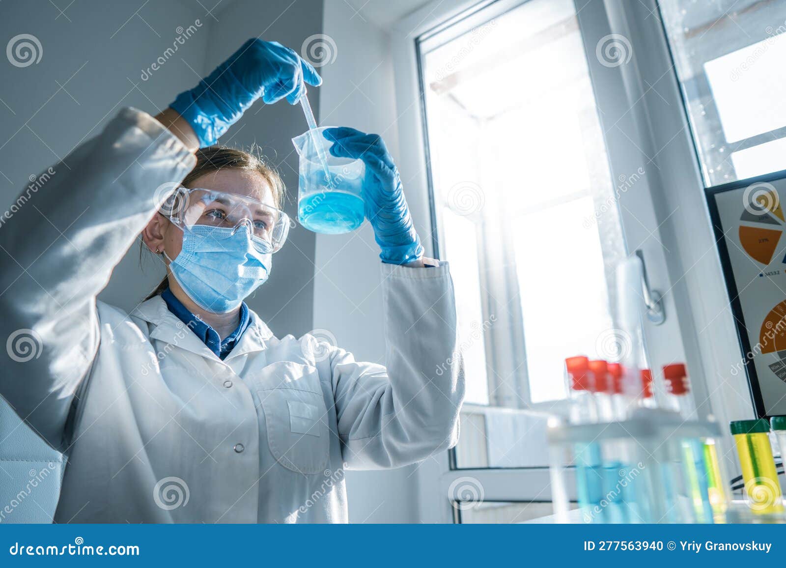 The Photo Depicts a Scientist Testing on Instruments in a Chemical ...