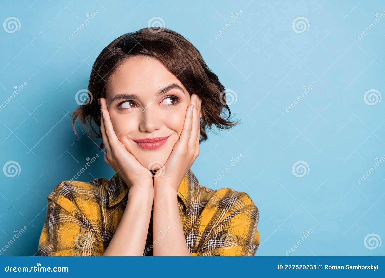 Photo Of Dreamy Inspired Adorable Girl Hands Cheeks Look Empty Space
