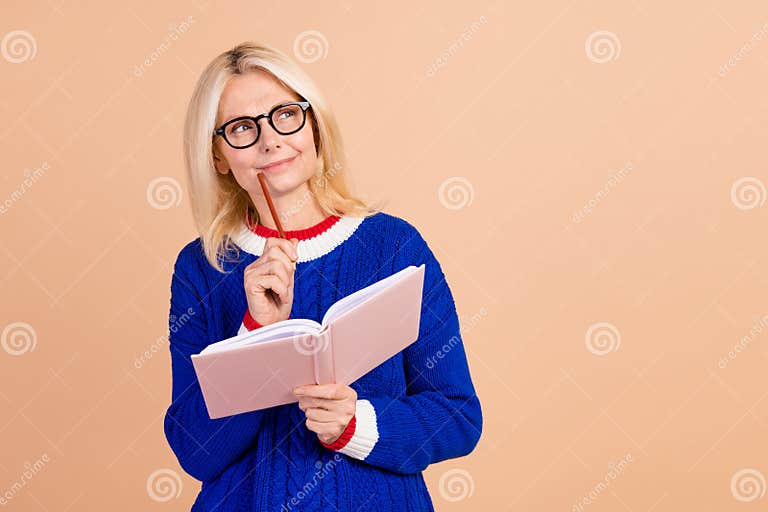 Photo Of Dreamy Woman Dressed Knitwear Sweater In Glasses Write Book
