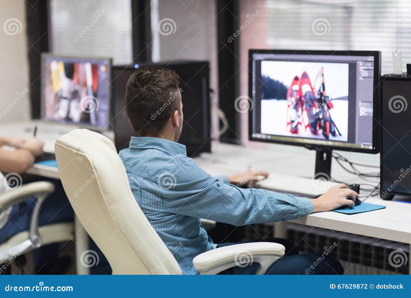 Photo editor at his desk stock photo. Image of computer - 67629872