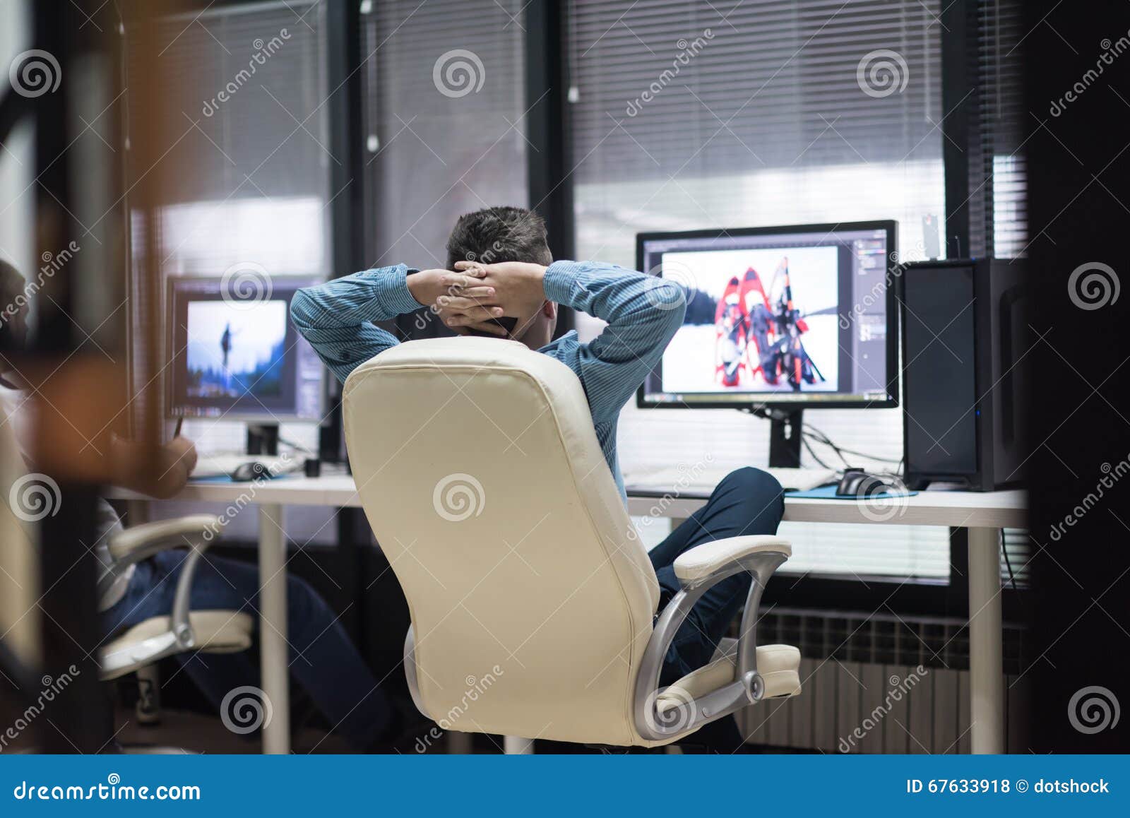 Photo editor at his desk stock photo. Image of graphic - 67633918