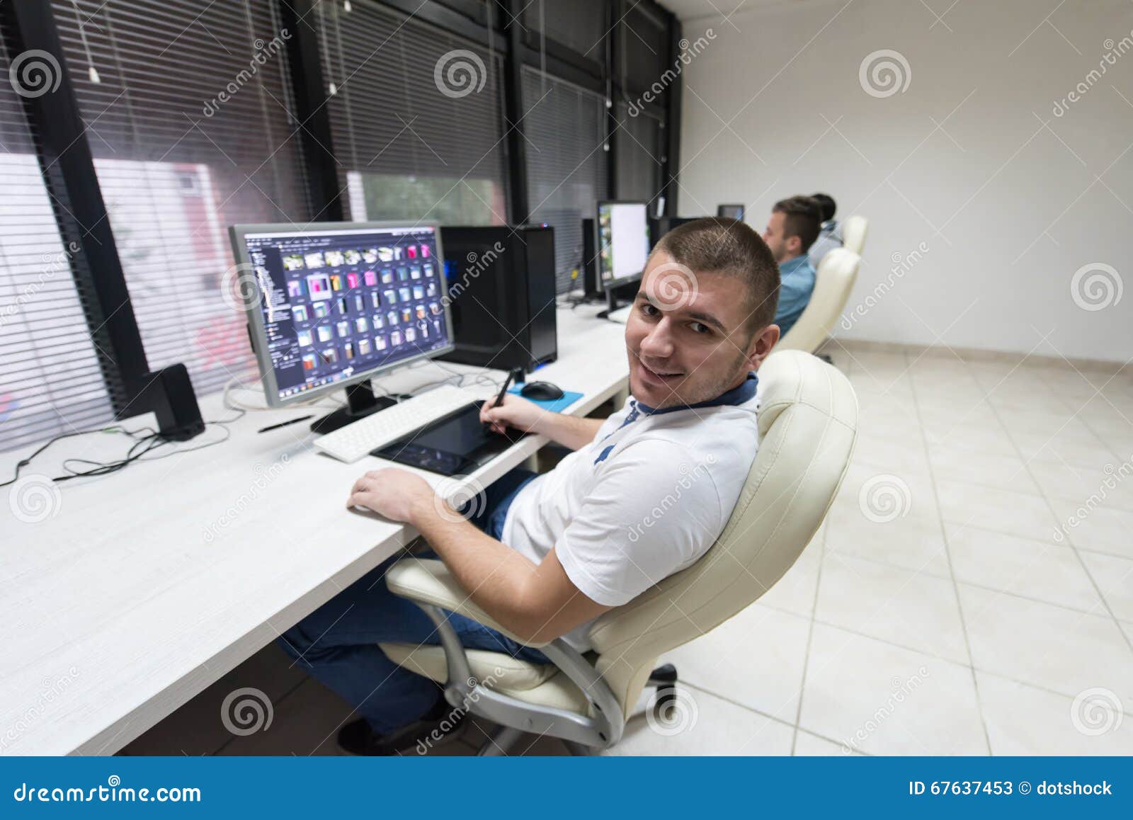 Photo editor at his desk stock image. Image of portrait - 67637453