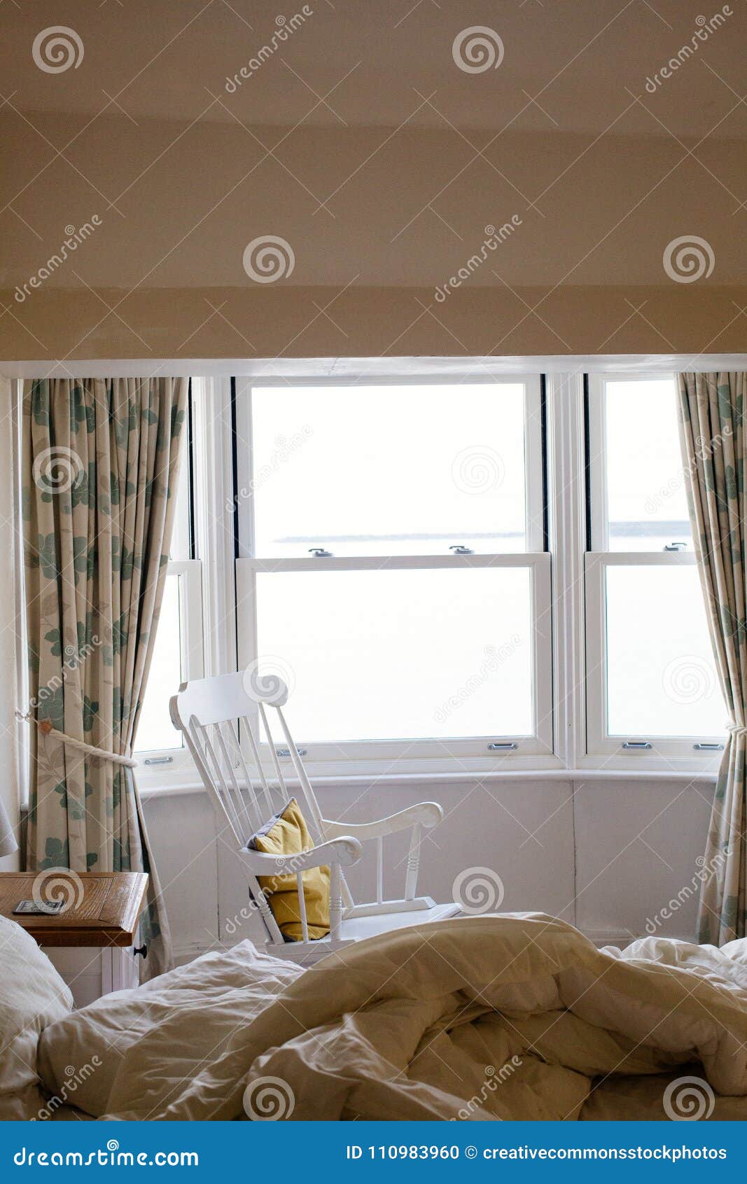 Photo Of Empty White Rocking Chair Beside Window Picture. Image: 110983960