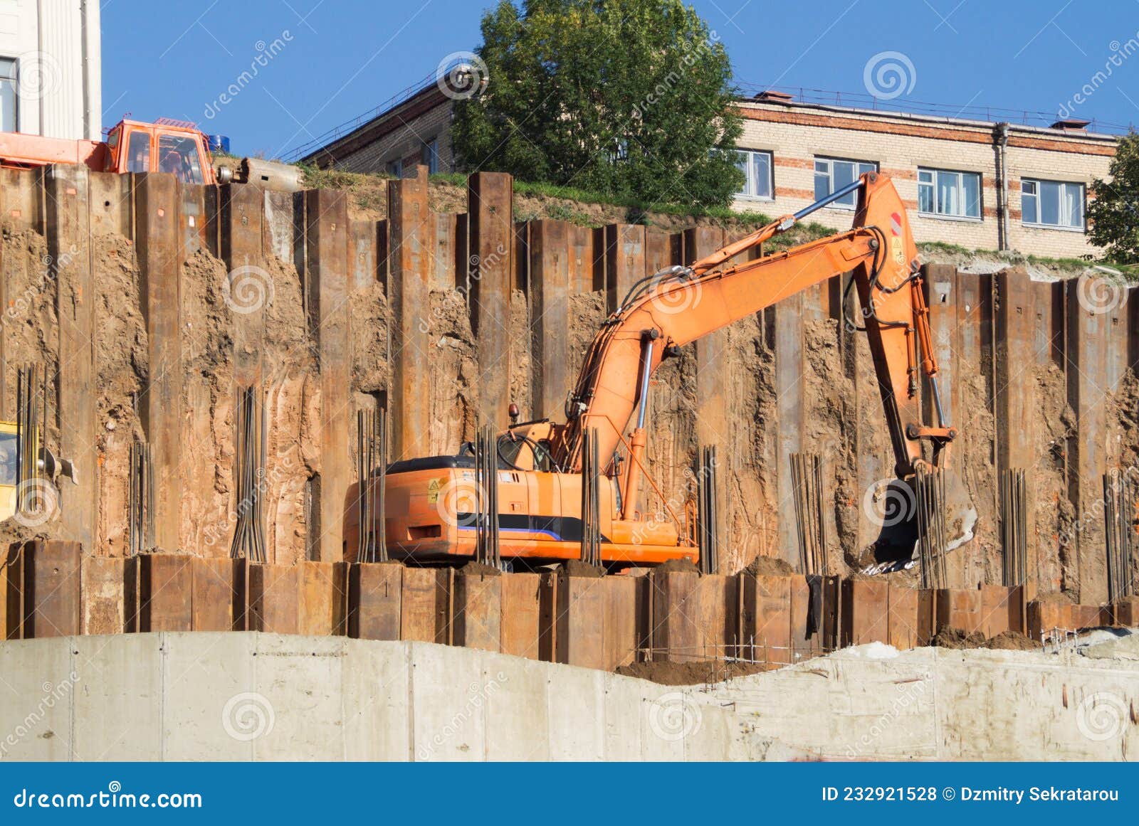 On the Photo Excavator Performs Excavation Work on the Swamp Stock ...