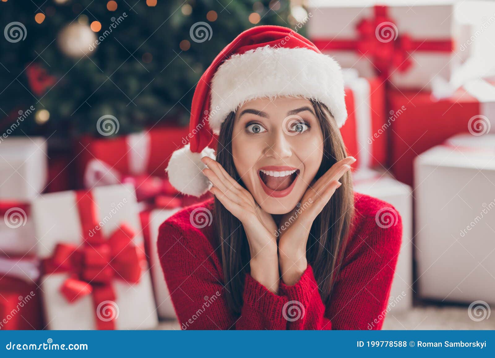 Photo Of Excited Cute Lady Boxes Arms Face Open Mouth Wear Santa