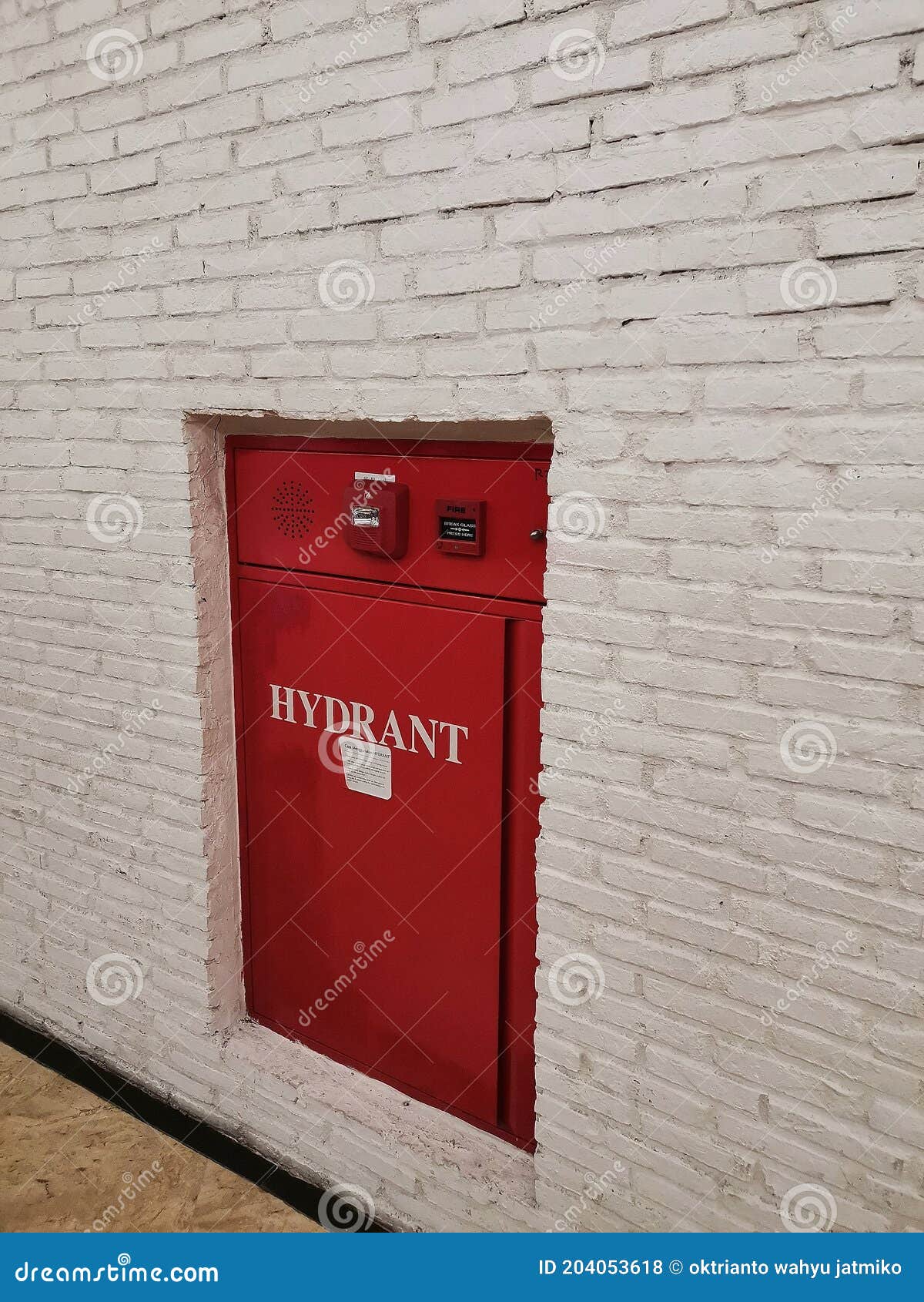 Photo of Fire Hydrant on the Wall Stock Photo - Image of signage ...