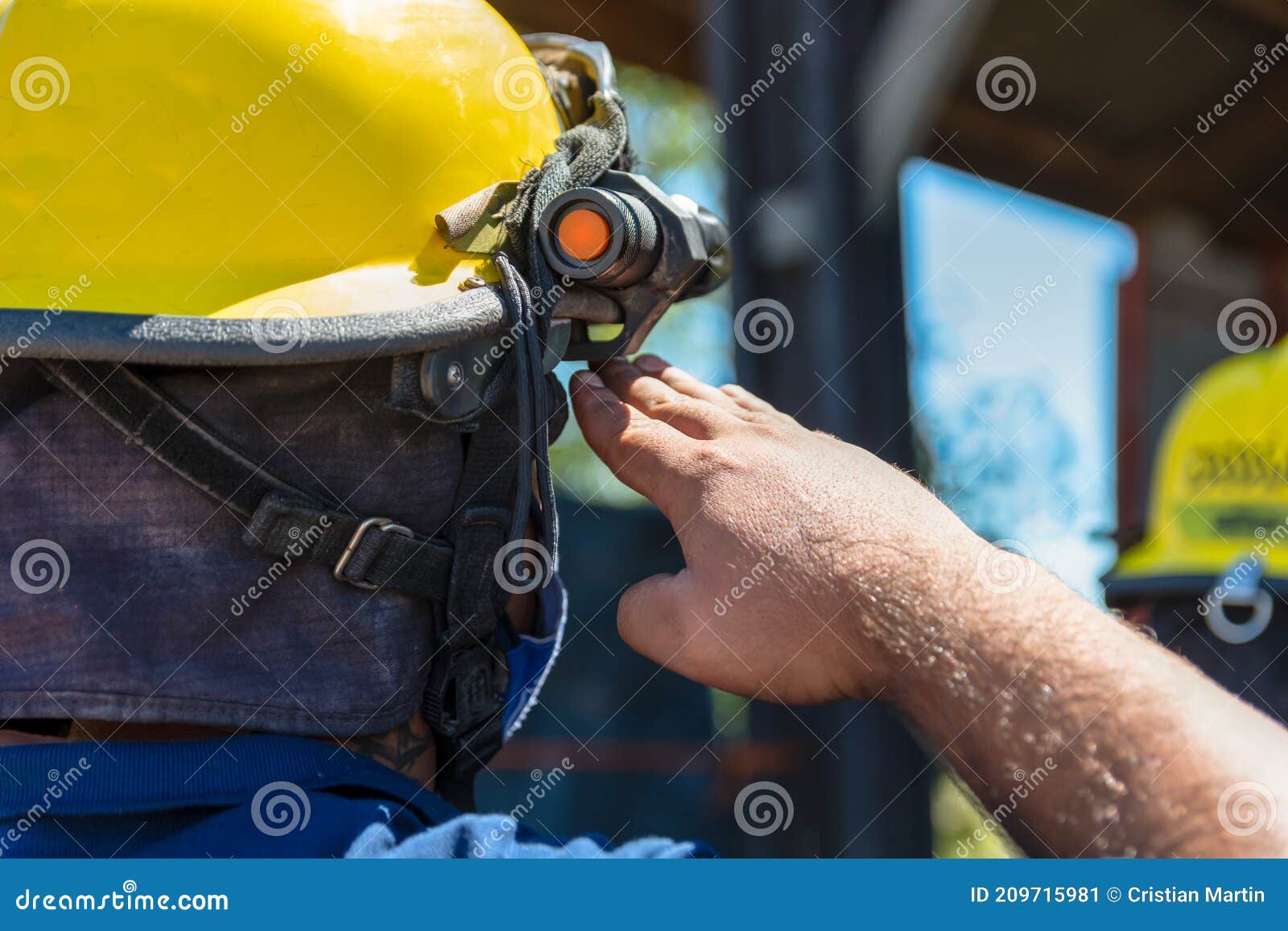 Photo of Firefighter Waving from Behind Stock Image - Image of ...
