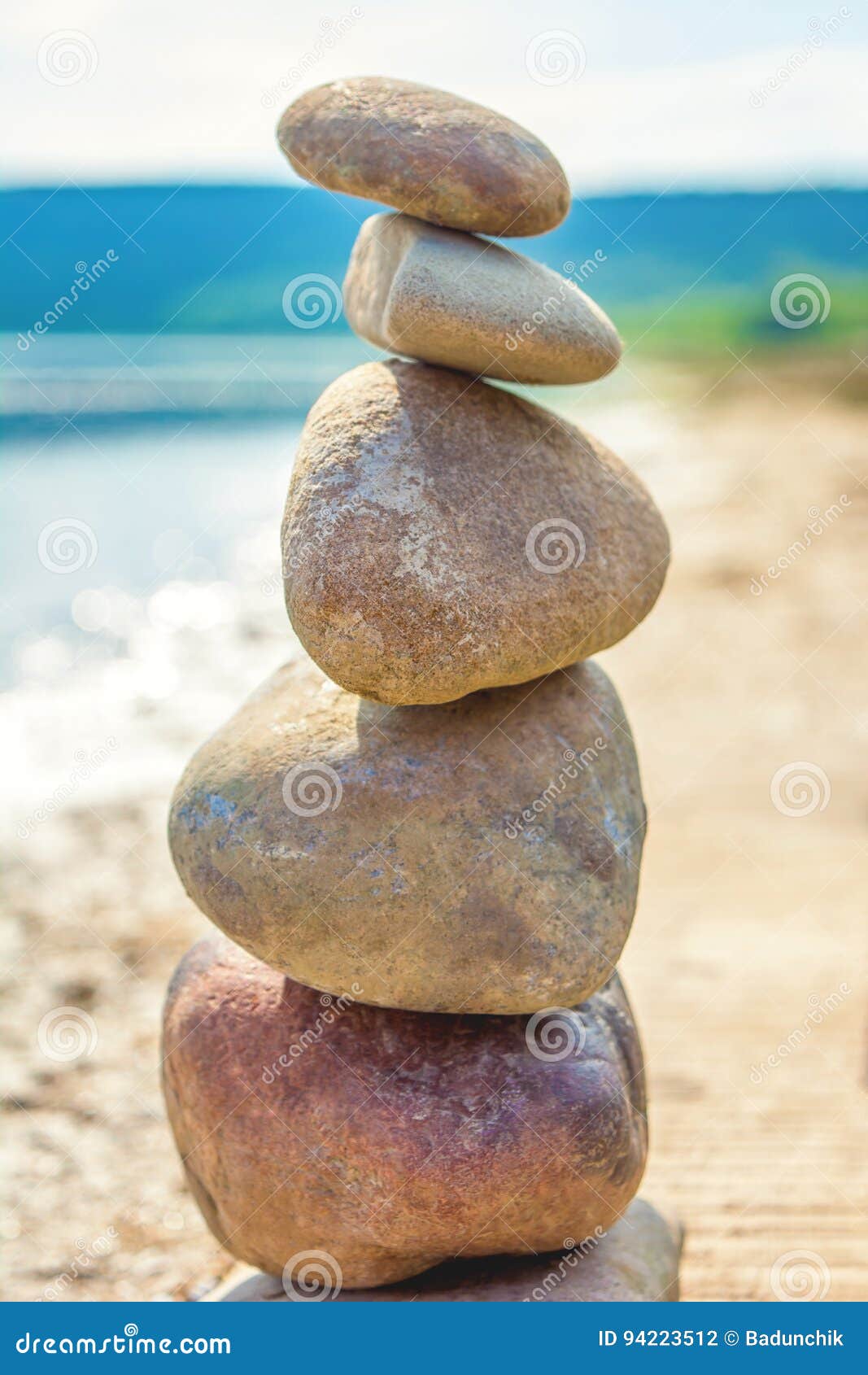 Photo of Five Stones Balanced on Top of Eachother on a Beach Stock ...