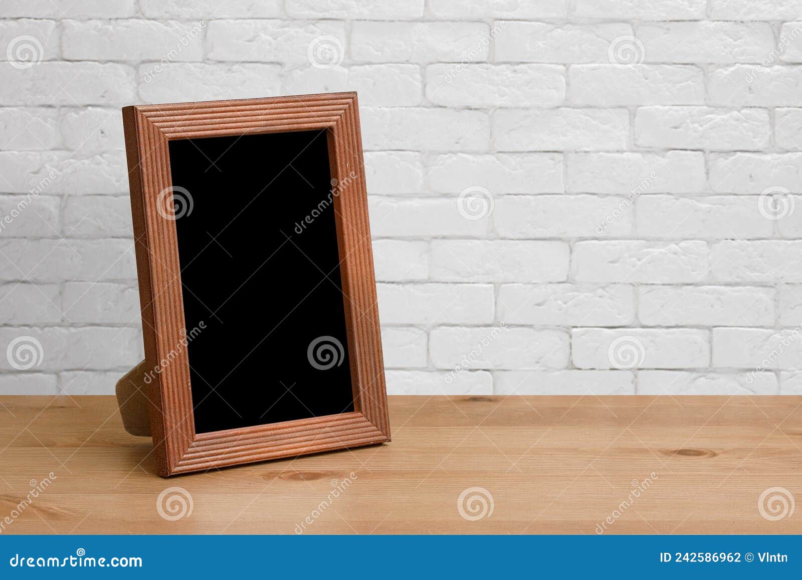 Photo frame on the table stock photo. Image of brown - 242586962